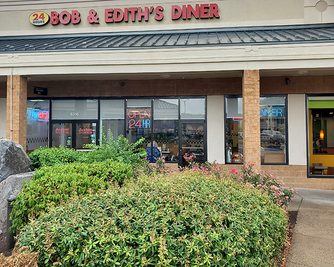 The iconic red signage of Bob & Edith's Diner promises 24-hour comfort in Springfield. Like a lighthouse for the hungry, it beckons with the promise of classic American fare.