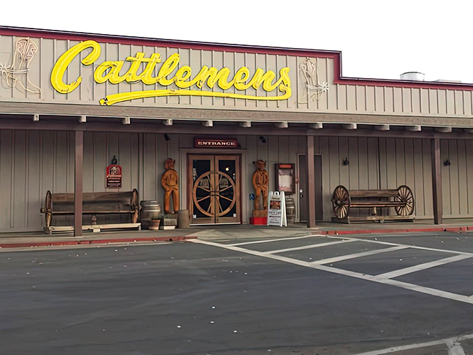 The iconic yellow Cattlemens sign and wagon wheel entrance doors promise a Western adventure where the steaks are as big as your appetite.