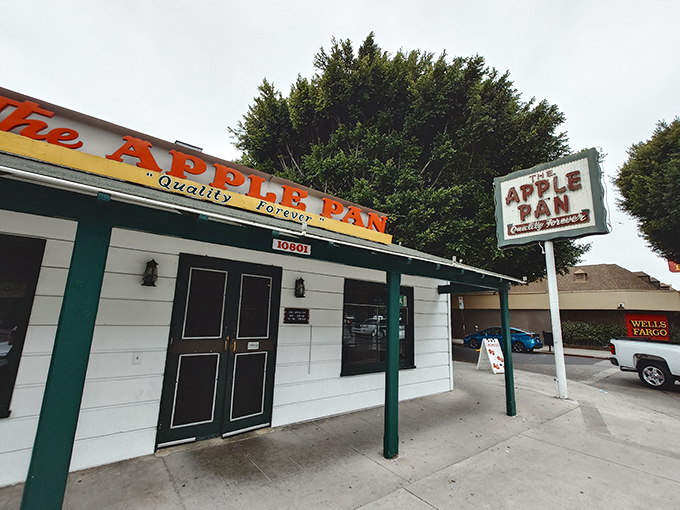 The unassuming exterior of The Apple Pan belies the culinary treasures within. Like finding a rare vinyl in a dusty record shop, this place is pure Los Angeles gold.