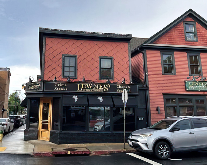 The iconic coral-colored exterior of Lewnes' Steakhouse stands as a beacon for steak lovers in Annapolis, promising old-school charm and timeless flavors inside.