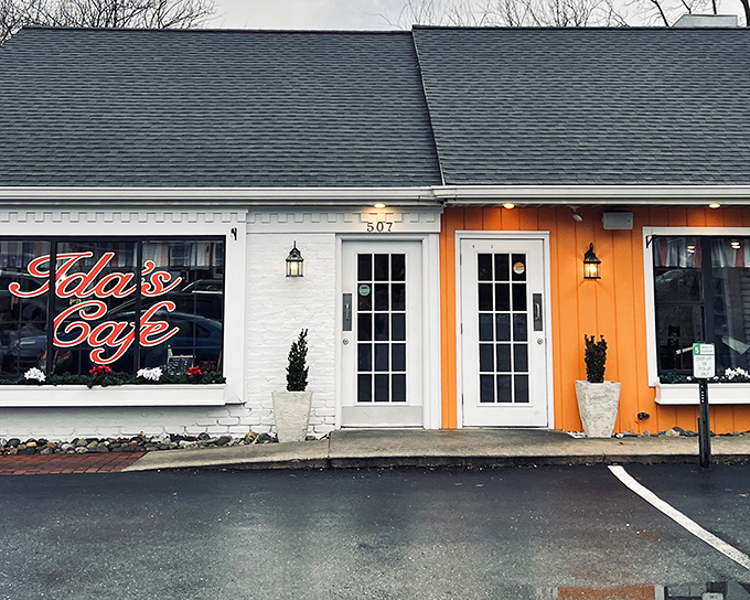 The orange and white facade of Ida's Cafe beckons like a culinary lighthouse, promising comfort and satisfaction to hungry travelers on Rohrerstown Road.