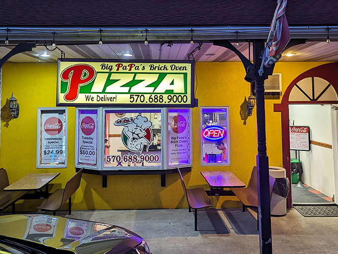 The neon glow of Big PaPa's at night isn't just a beacon for hungry travelers&mdash;it's a promise of brick oven perfection waiting inside.