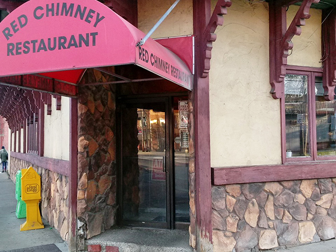 The iconic Red Chimney sign stands like a time capsule against Cleveland's blue sky, beckoning hungry travelers to this Slavic Village treasure.