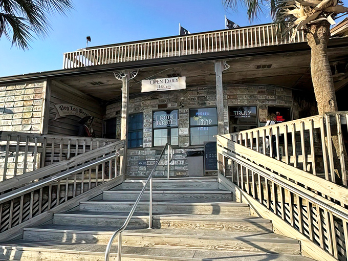The stairway to seafood heaven! Weathered wooden steps and pirate flags beckon hungry travelers to this Pensacola Beach treasure trove.