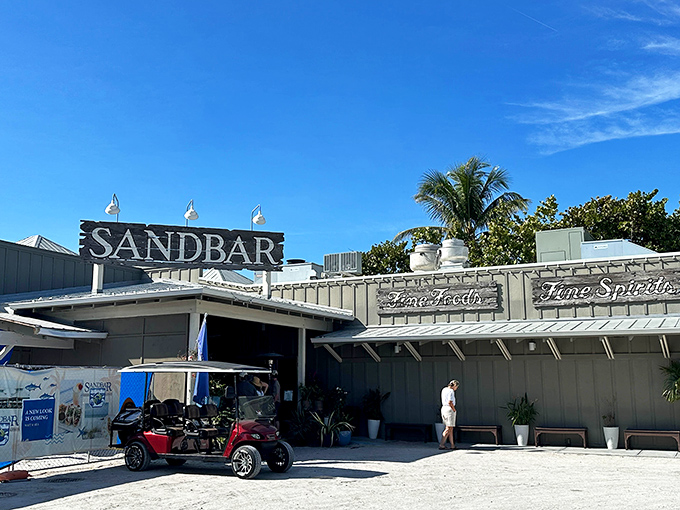 The Sandbar's weathered sign and sandy entrance say everything you need to know: leave your pretensions at home and bring your appetite instead.