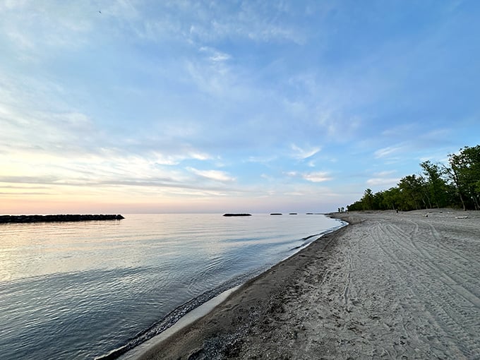 Miles of golden shoreline stretch into the distance, where Lake Erie's gentle waves create nature's own meditation soundtrack.