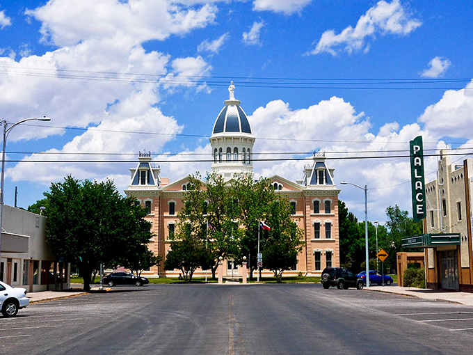 Downtown Marfa, where the historic Presidio County Courthouse stands like a Victorian sentinel watching over a town where time moves at its own delightful pace.