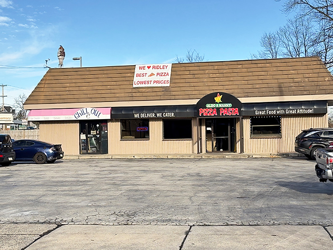The unassuming exterior of Chill Out Ice Cream shares space with a pizza place, proving that life's greatest pleasures often hide in plain sight.