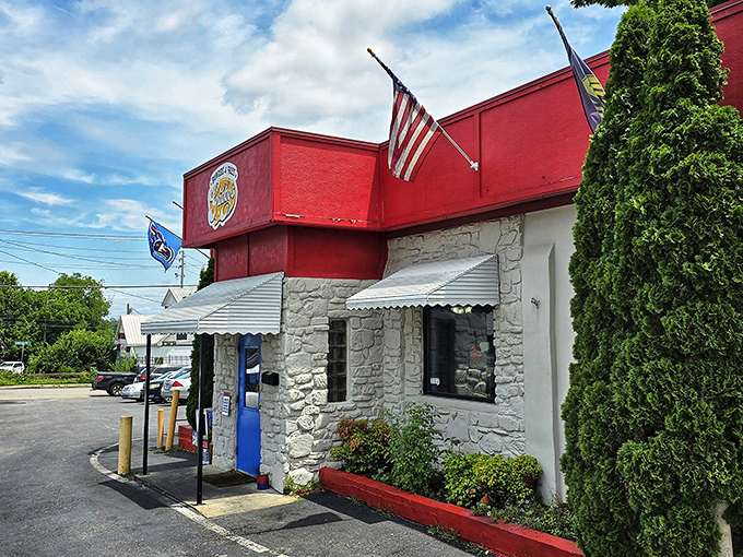 The patriotic red, white, and blue exterior isn't just eye-catching—it's a beacon for burger lovers seeking salvation from mediocre fast food chains.