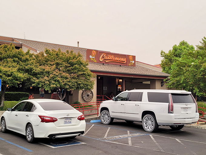 The iconic Cattlemens exterior beckons hungry travelers with its Western charm and cowboy boot signage&mdash;a beacon of beef in Redding's landscape.