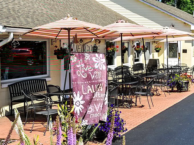 The unassuming yellow exterior of Clay's Cafe hides culinary treasures within, like a delicious secret waiting to be discovered in Hebron.