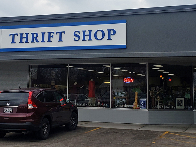 The unassuming storefront belies the treasure trove within. American flags frame the entrance like sentinels guarding a portal to bargain paradise.
