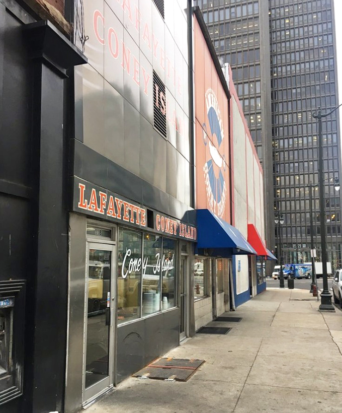 The iconic facade of Lafayette Coney Island stands proudly next to its rival, American. Detroit's culinary cold war continues deliciously on this corner.