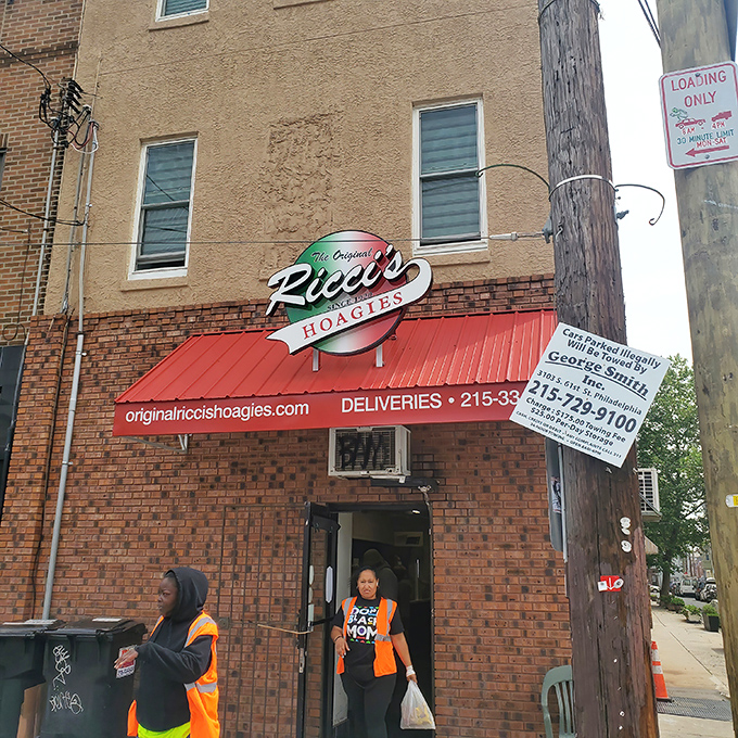 The corner brick building with its iconic red awning stands like a sandwich sentinel, guarding Philadelphia's hoagie heritage for generations.