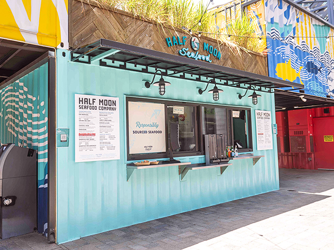 The turquoise shipping container exterior of Half Moon Seafood Co. isn't just eye-catching&mdash;it's a beacon for seafood lovers hiding in plain sight.