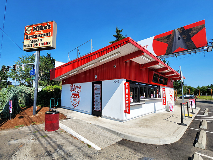 The bright red exterior of Mike's Drive-In stands as a beacon of burger hope in Milwaukie, where nostalgia meets hunger in perfect harmony.