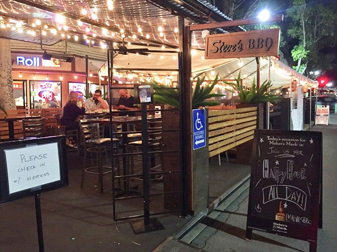 The inviting exterior of Steve's BBQ glows with string lights, creating that "you've just discovered something special" atmosphere in Whittier.