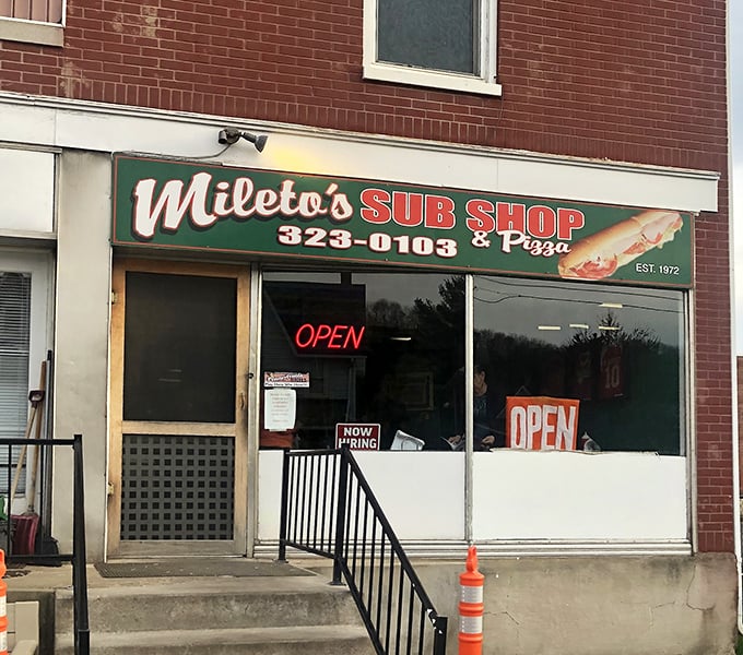The unassuming brick façade of Mileto's hides culinary treasures that locals have cherished since 1972. Some buildings don't need to shout—their sandwiches do the talking.