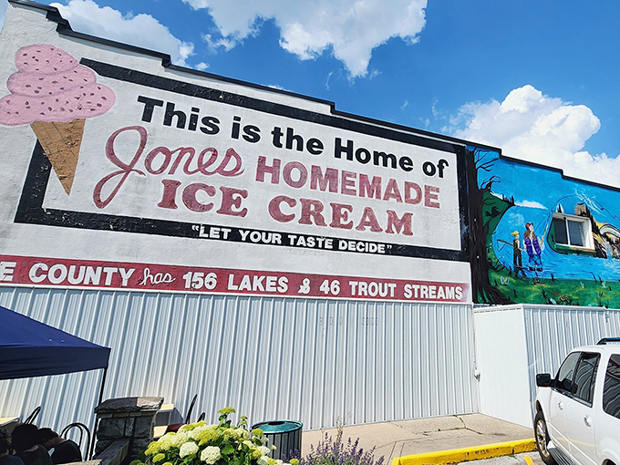 The iconic storefront of Jones' Homemade Ice Cream stands proudly in Baldwin, a beacon of dairy delight with its unmistakable red awning and vintage charm.