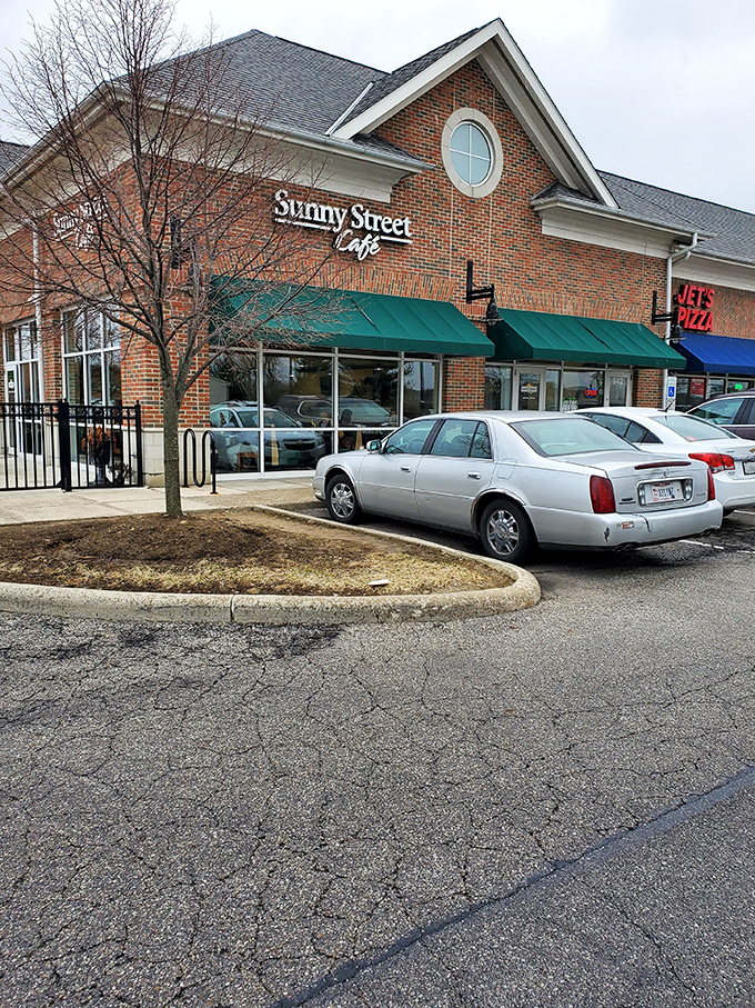 This brick beauty in Westerville proves that good things come wrapped in green awnings and endless parking spots.