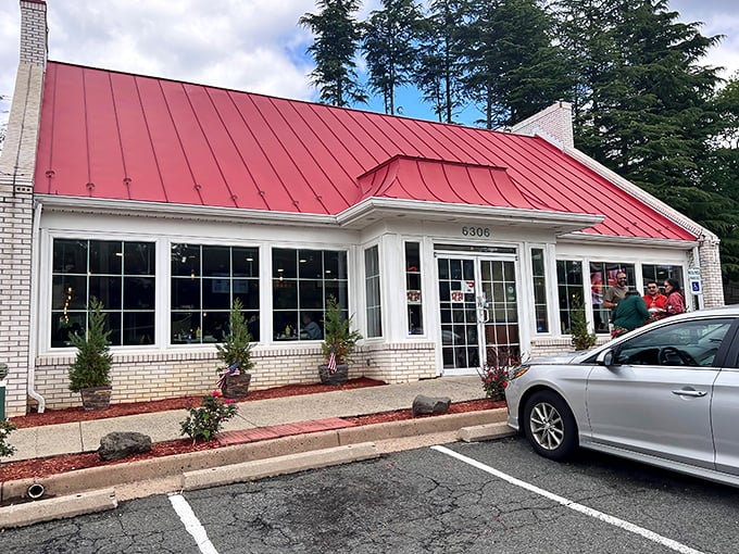 The iconic red-roofed Barnside Diner stands like a beacon of breakfast hope, promising culinary comfort beneath its cheerful chef sign. 
