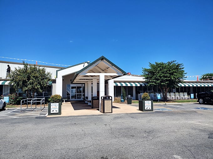 The welcoming facade of Lane Southern Orchards stands ready to introduce you to Georgia's sweetest treasures. White rocking chairs await tired shoppers.