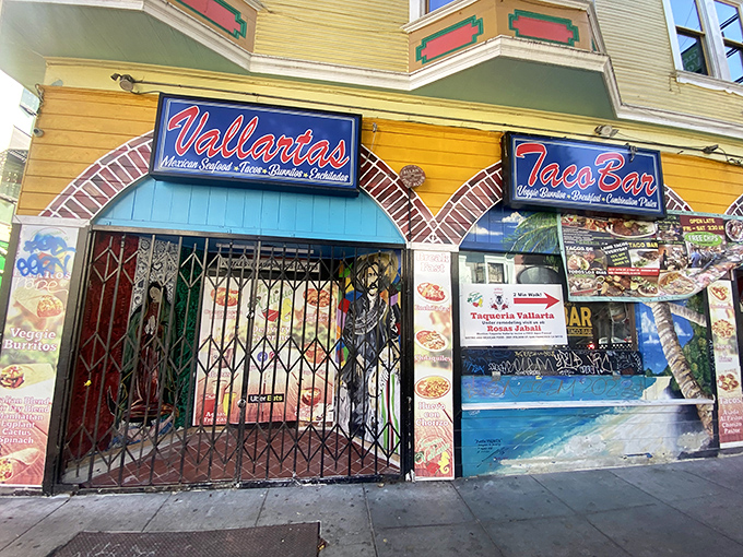 The vibrant yellow exterior of Taqueria Vallarta stands out in San Francisco's Mission District like a beacon of culinary promise.