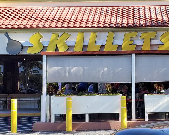 The bright yellow sign beckons like a culinary lighthouse on Airport-Pulling Road, promising comfort food treasures within those terra cotta-roofed walls.