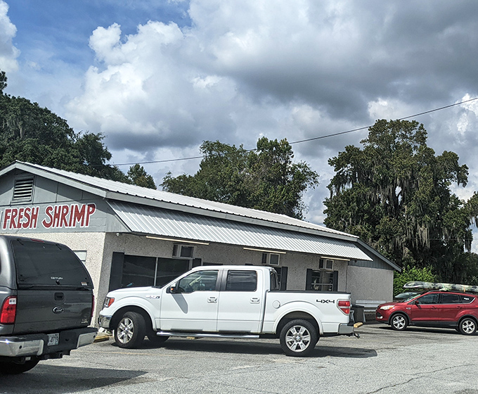 The unassuming exterior of B & J's proudly announces "FRESH SHRIMP" - a simple promise that this coastal Georgia gem delivers on spectacularly.