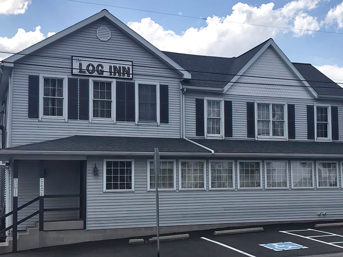The unassuming white exterior of The Log Inn belies the culinary treasures within. History and comfort food await behind these doors.
