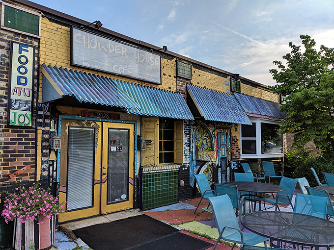 The sunshine-yellow exterior with vibrant blue awnings feels like stumbling upon a secret culinary treasure map where X marks the delicious spot.