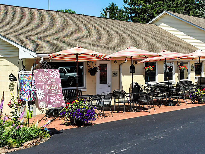 The unassuming yellow exterior of Clay's Cafe hides culinary treasures within, like a delicious secret waiting to be discovered in Hebron.
