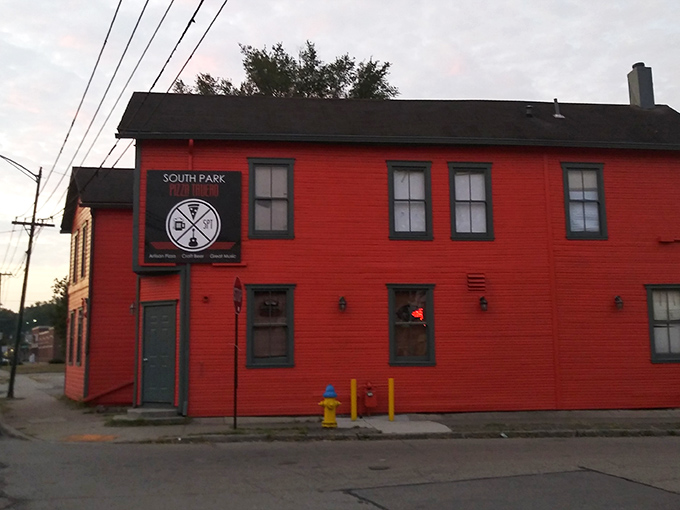 The fire-engine red exterior of South Park Pizza Tavern stands out like a culinary lighthouse, beckoning hungry travelers to dock for delicious discoveries.