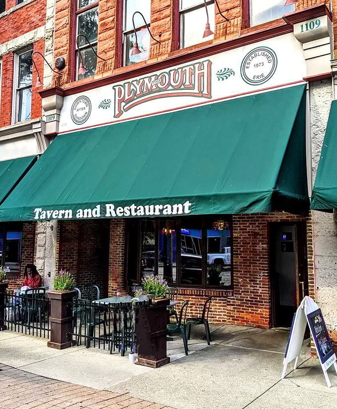 The brick fa&ccedil;ade of Plymouth Tavern stands proudly on Erie's State Street, a three-story testament to timeless hospitality that beckons hungry travelers inside.