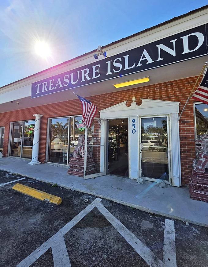 The unassuming exterior of Treasure Island Antiques in Naples belies the wonderland of vintage treasures waiting inside. American flags and stone guardians welcome curious explorers.