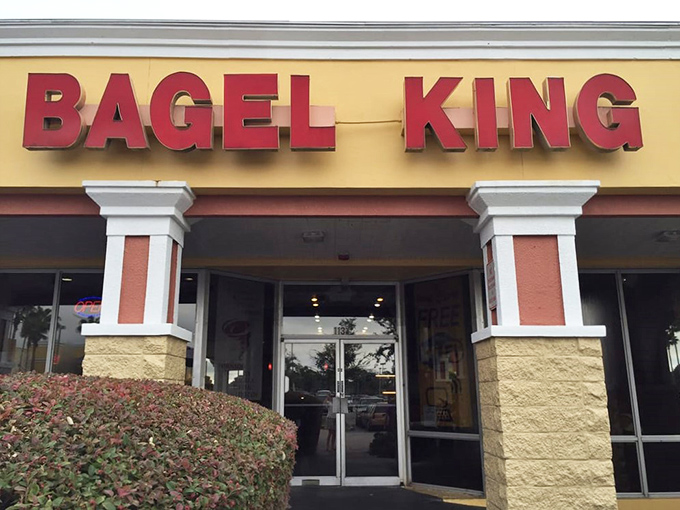 The bright red letters of Bagel King stand proud against the yellow facade, like a beacon calling hungry breakfast seekers home.