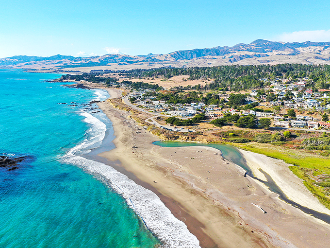 Cambria's coastline looks like Mother Nature showing off her best work—turquoise waters meeting golden shores under California's impossibly blue skies.