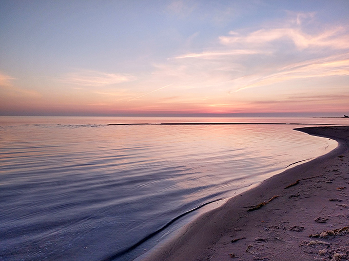 Miles of pristine shoreline await at Negwegon, where Lake Huron's gentle waves create nature's perfect soundtrack for beach wanderers and soul-searchers alike.
