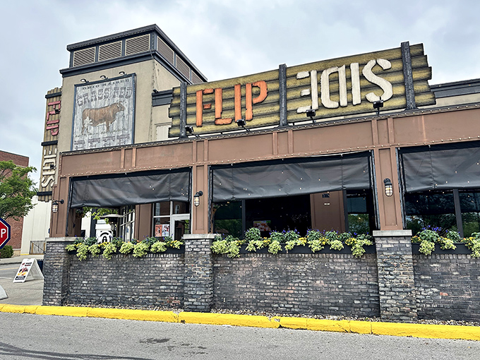 The unassuming exterior of Flip Side beckons with its rustic charm and brick patio wall. This hidden gem doesn't need flashy signs to announce its culinary treasures.