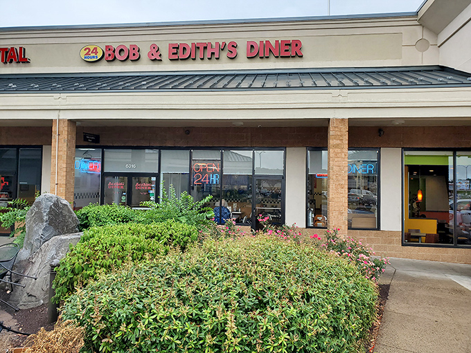 The iconic red signage of Bob & Edith's Diner glows like a beacon for hungry travelers. This 24-hour Springfield institution promises comfort food salvation at any hour.