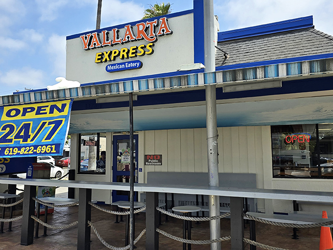 The blue and yellow beacon of Vallarta Express stands proud on Garnet Avenue, promising 24/7 Mexican food salvation for hungry San Diegans.