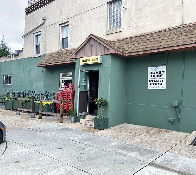 The iconic green exterior of Triangle Tavern, complete with Gritty mural, welcomes hungry Philadelphians like an old friend with new tricks.