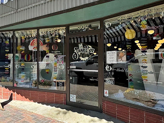 The classic striped awning and twinkling lights of Little O's beckon like a time machine disguised as a storefront. Step inside for a sweet escape from the modern world.