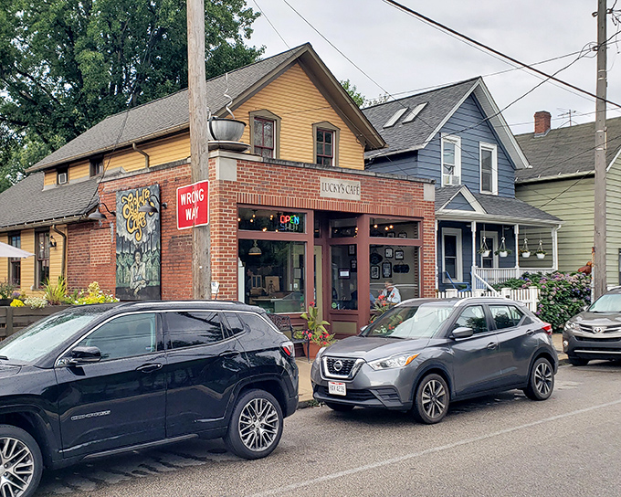 The charming brick-and-yellow exterior of Lucky's Cafe stands like a beacon of breakfast hope in Cleveland's Tremont neighborhood.