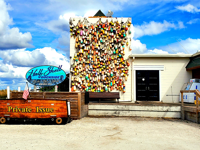 The wall of colorful buoys isn't just decoration—it's a maritime résumé telling stories of waters navigated and catches landed.
