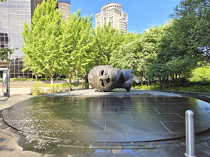"Eros Bendato" lounges in his reflecting pool like someone who fell asleep during a spa day. Downtown St. Louis skyscrapers create the perfect backdrop for this iconic bronze head.
