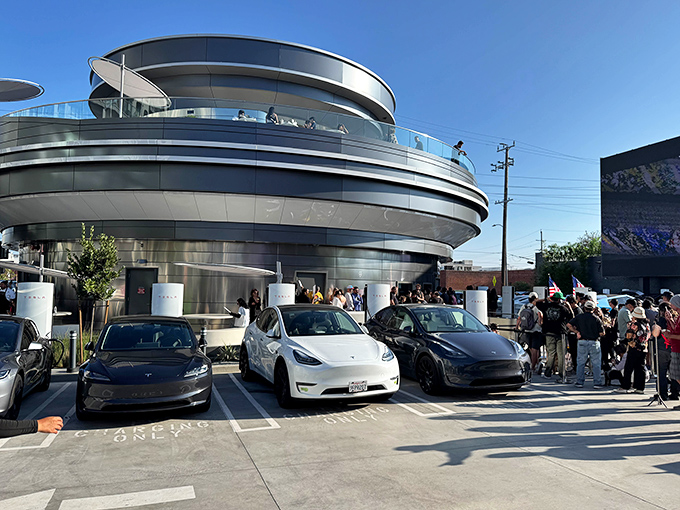 The Tesla Diner's gleaming exterior looks like a spaceship that landed in Los Angeles and decided to serve burgers instead of abducting cows. 
