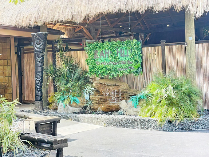 Modern tiki architecture meets tropical paradise in this stunning Sarasota exterior that beckons like a neon lighthouse.