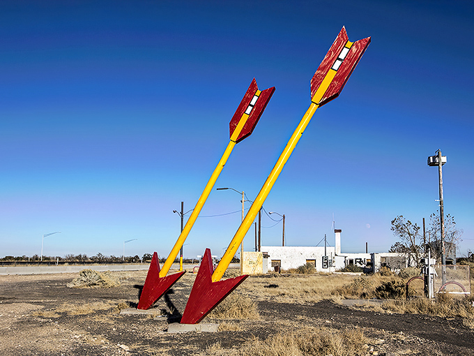 That magnificent arrow stands like a desert sentinel, pointing toward adventures only Route 66 can deliver.