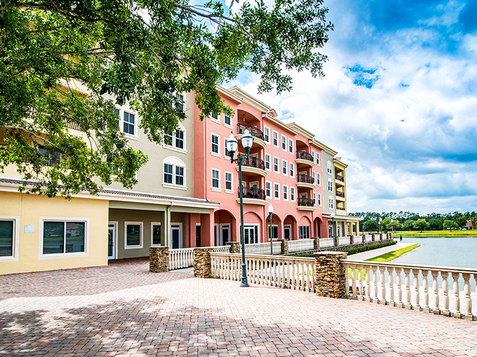 Pastel-colored buildings line the waterfront promenade, creating a scene that would make any Italian coastal town blush with envy.